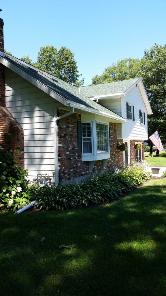 2nd Story overhang with drop onto roof | Capital Region Gutters